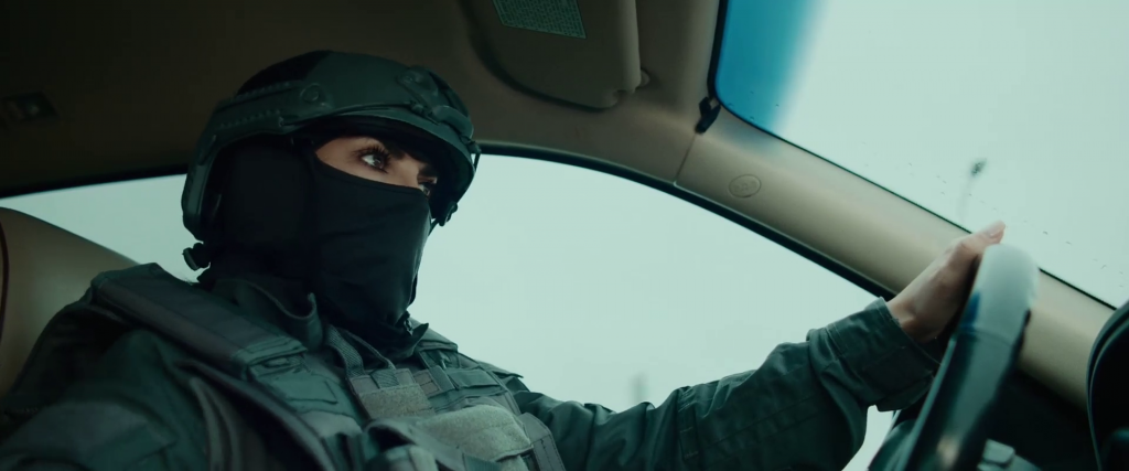 A masked female agent in tactical gear - Maskripper Org